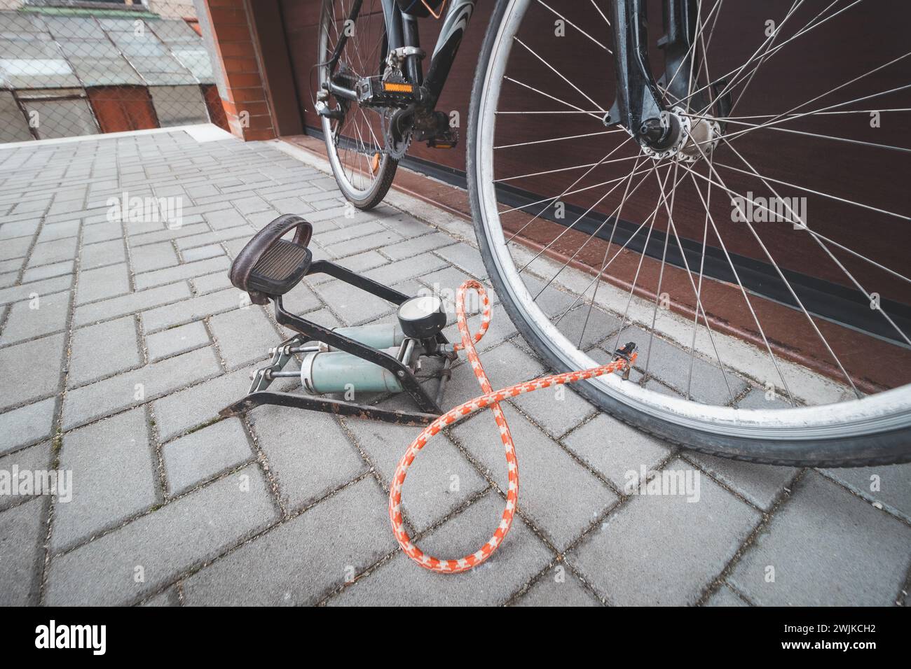 Man prepares his road bike for the season. Blowing out the bike's inner ...