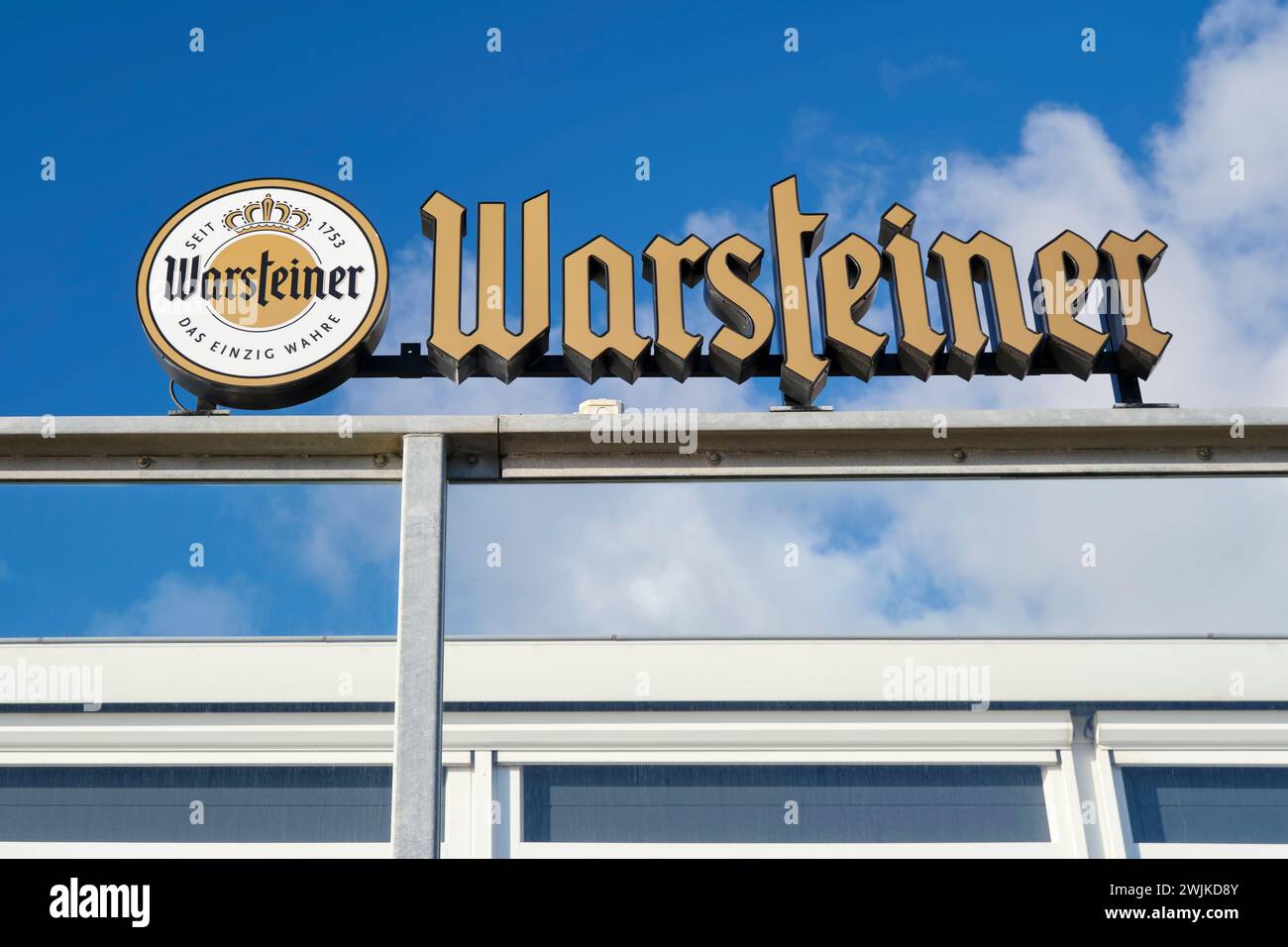 Warsteiner premium beer sign logo and brand text on restaurant terrace ...