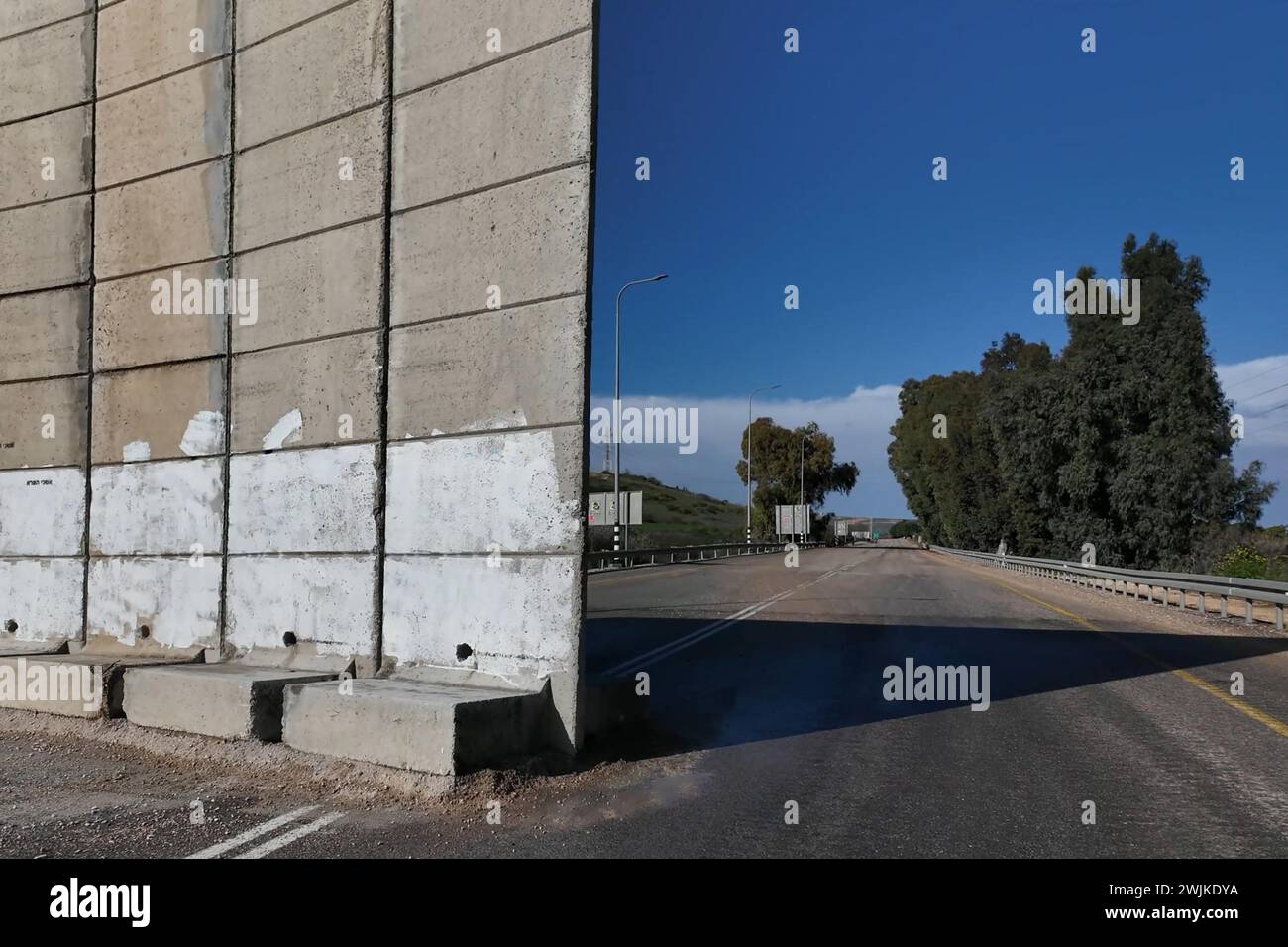 Security walls are placed on the way to the town of Metula situated ...