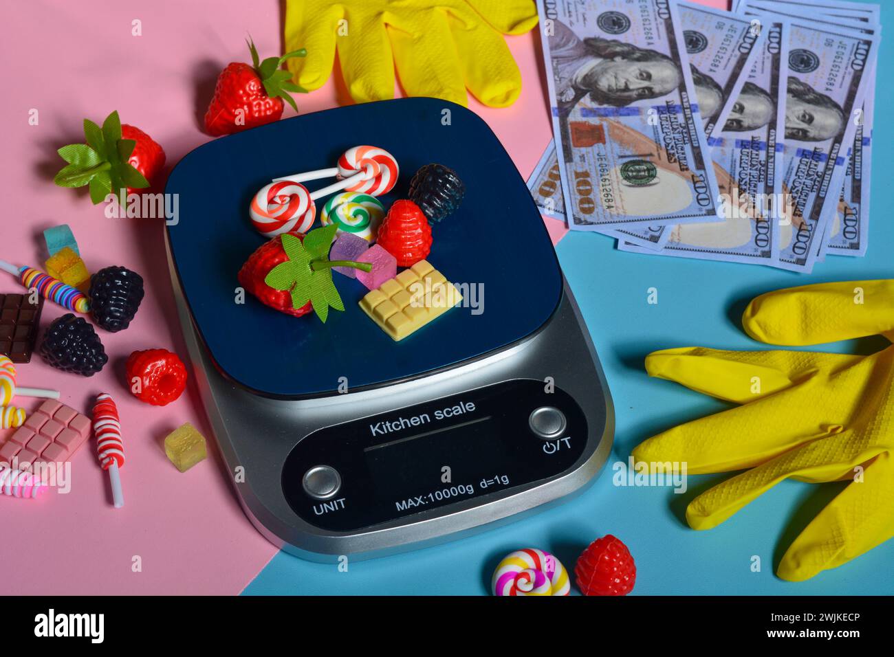 Digital scales that are weighing chocolate, strawberries and several ...