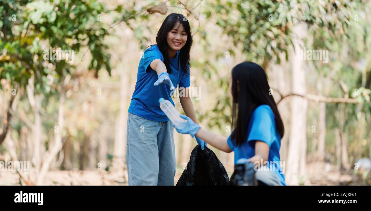 Group of volunteers, community members cleaning the nature from garbage ...