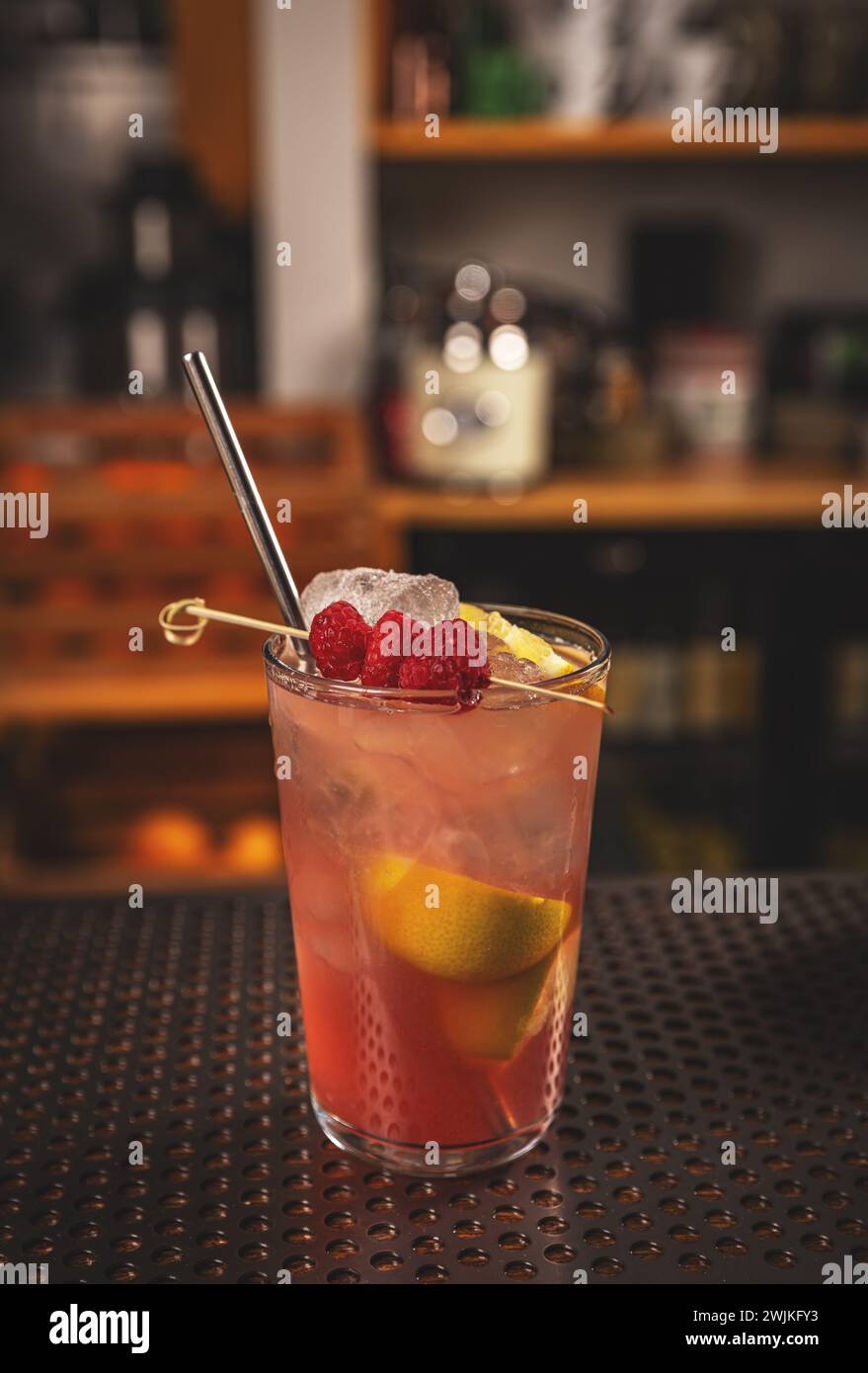 Summer raspberry mocktail with lemon and ice cube Stock Photo - Alamy