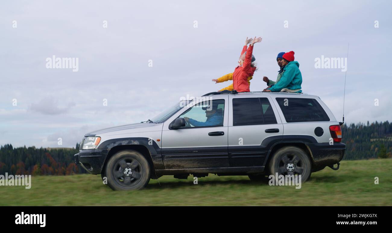 Group of diverse tourists together ride on vacation in mountains ...