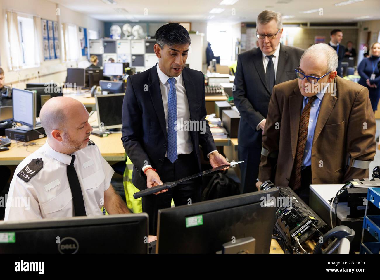 Britain's Prime Minister Rishi Sunak picks up a 'zombie knife' while ...