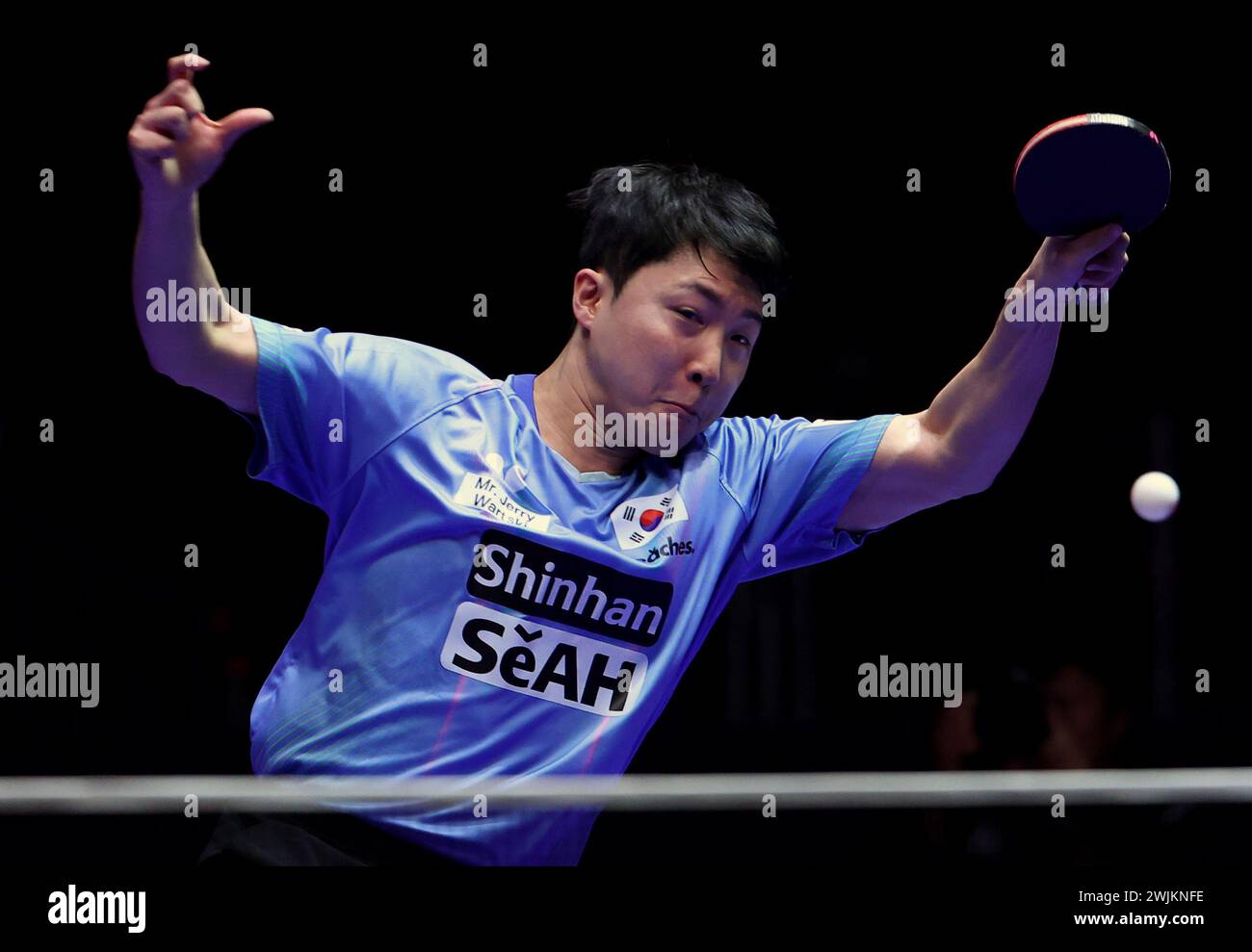 South Korea's Lim Jong-hoon returns a shot to Poland's Milosz Redzimski ...