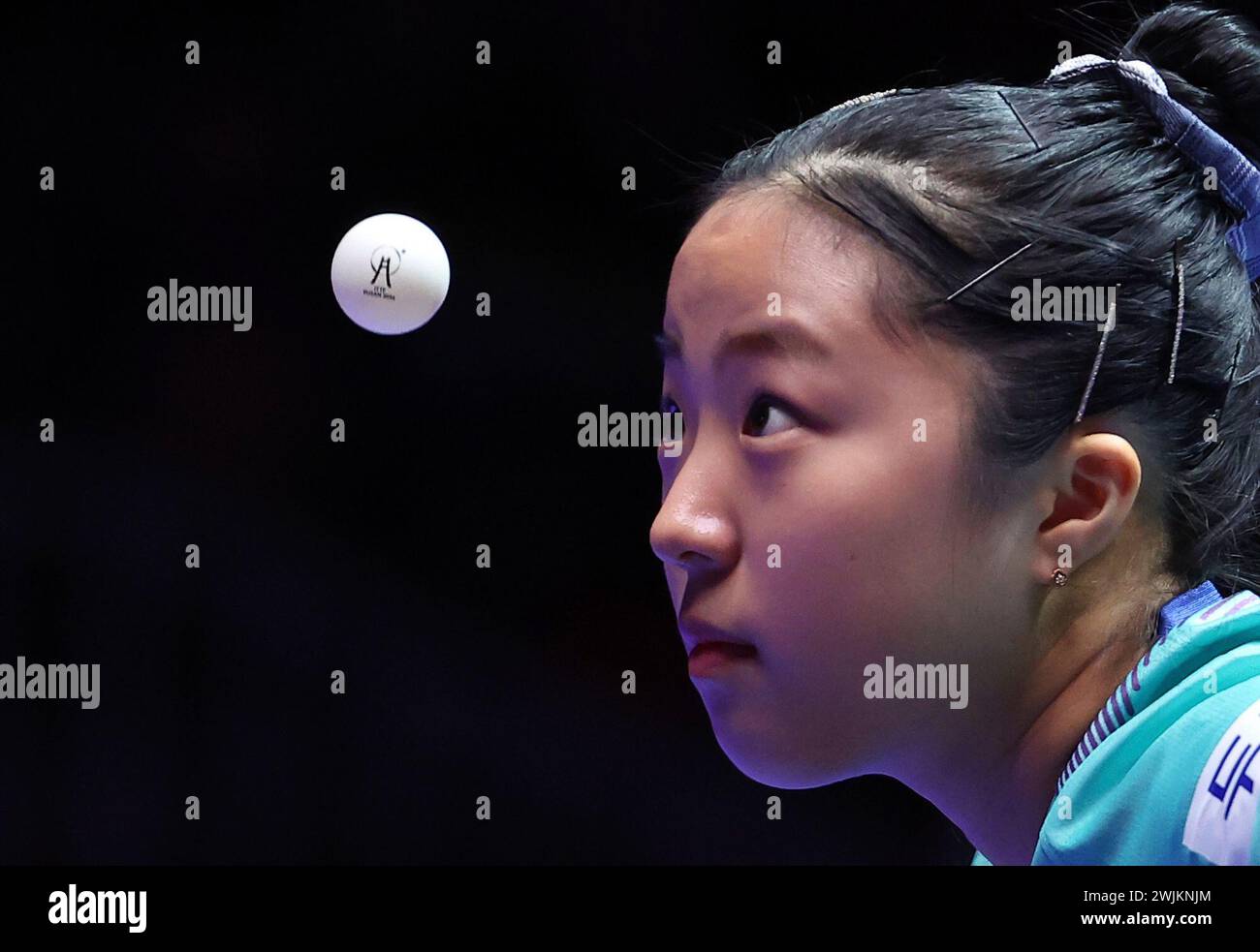 South Korea's Shin Yu-bin serves the ball to Italy's Nikoleta Stefanova ...