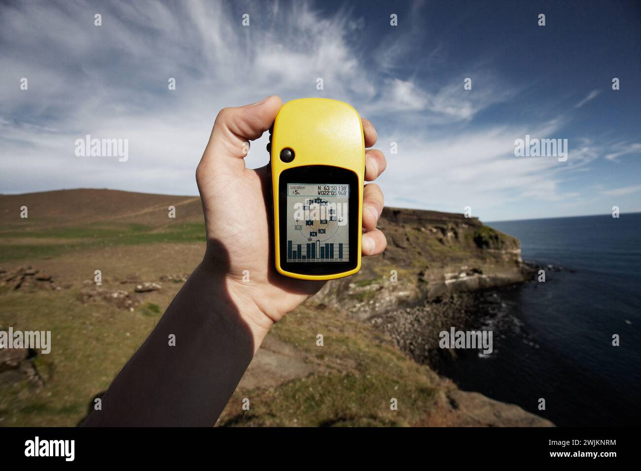 Hand Holding Yellow GPS Navigator, Reykjanes, Iceland Stock Photo - Alamy