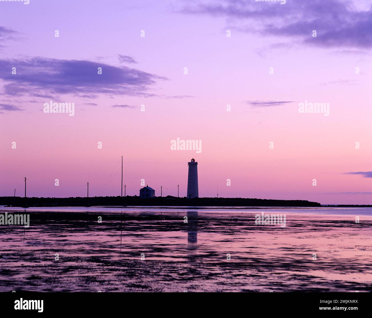 Coastal lighthouse calm magical sunset hi-res stock photography and ...