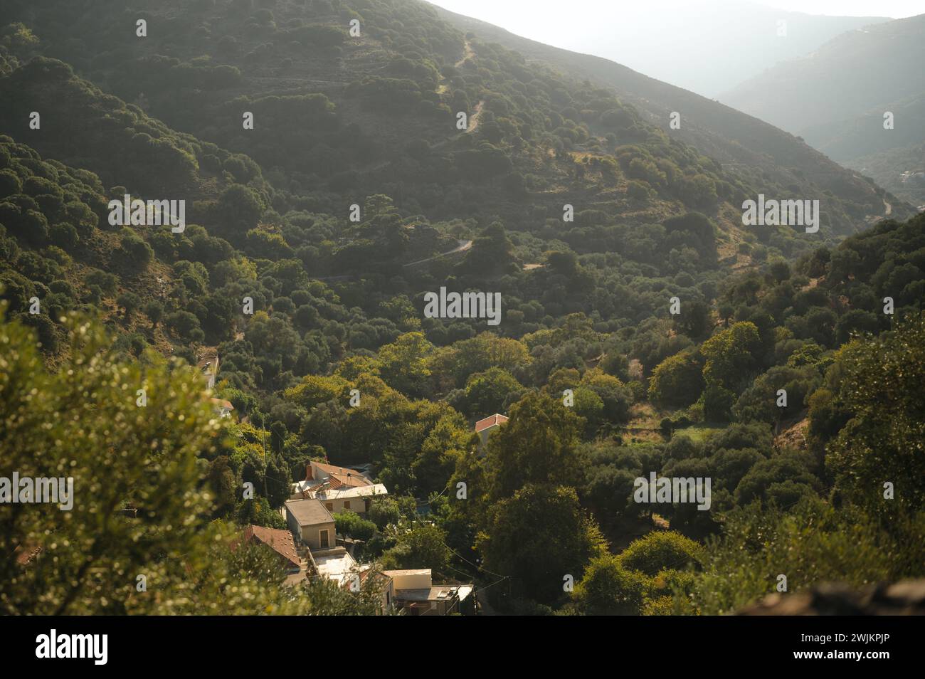 Scenic view of village nestled in the mountain ranges of Crete, Greece ...