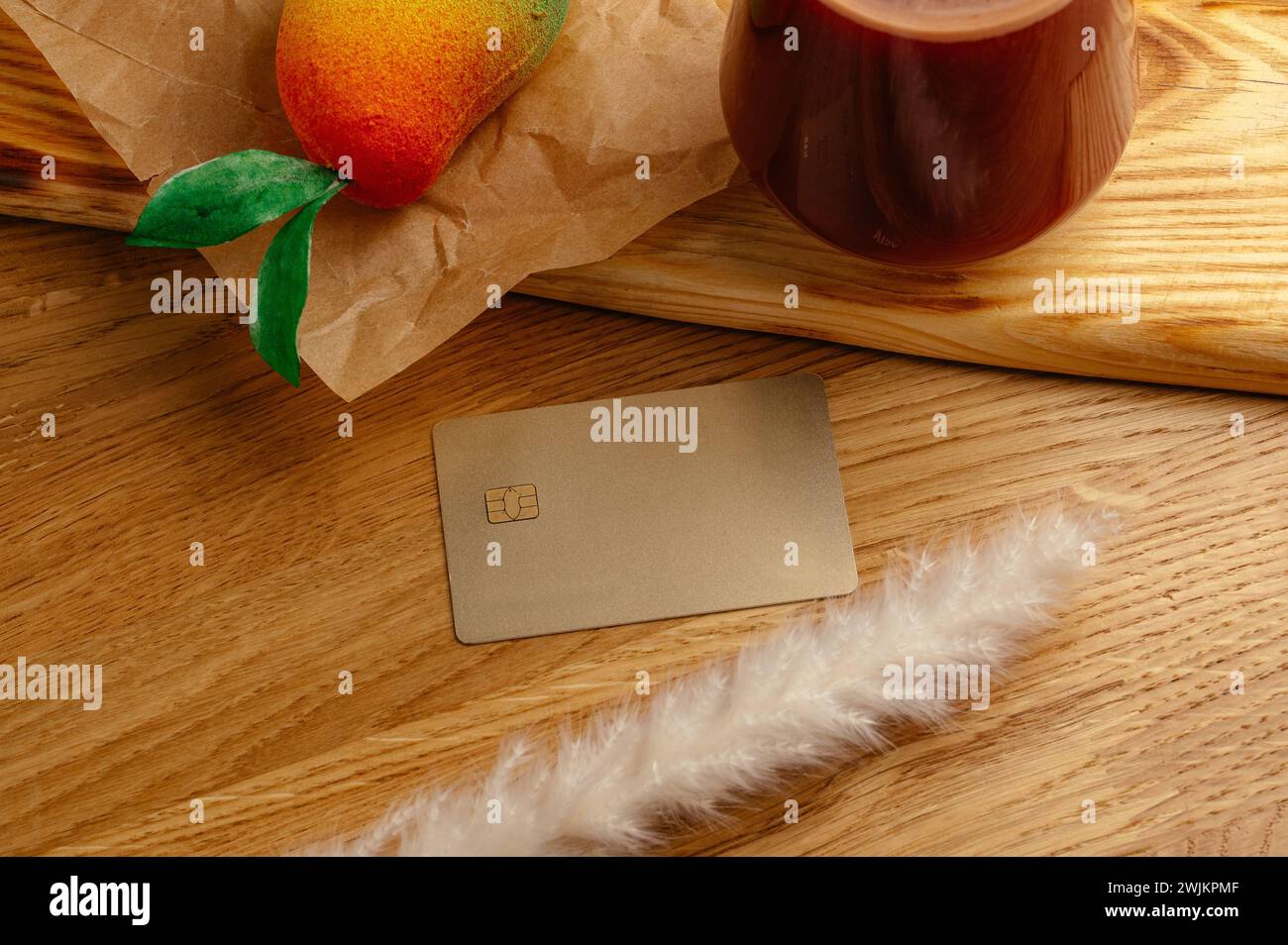 the bank card is on the table in the coffee shop next to the cof Stock ...
