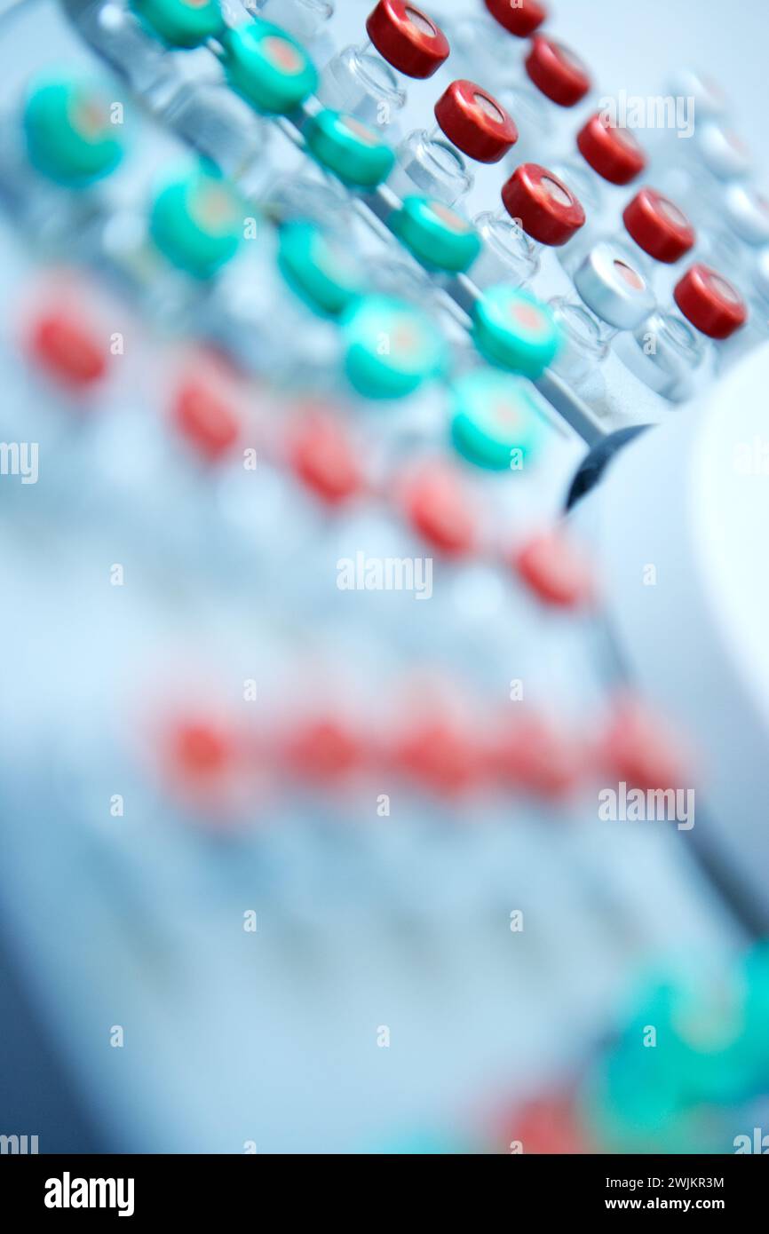 A close-up of vials with red and green caps Stock Photo - Alamy
