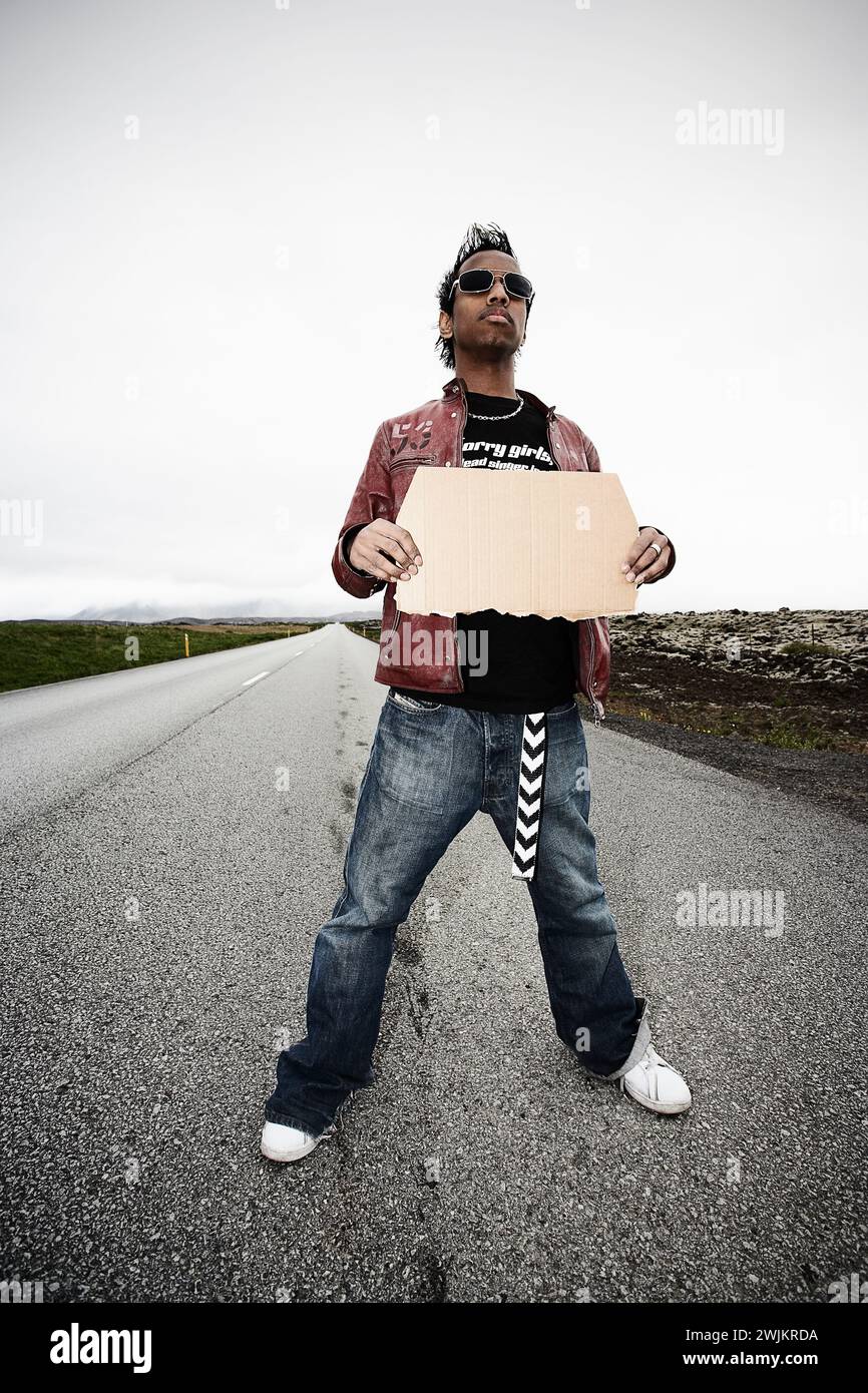 Hitchhiker with sign hi-res stock photography and images - Alamy