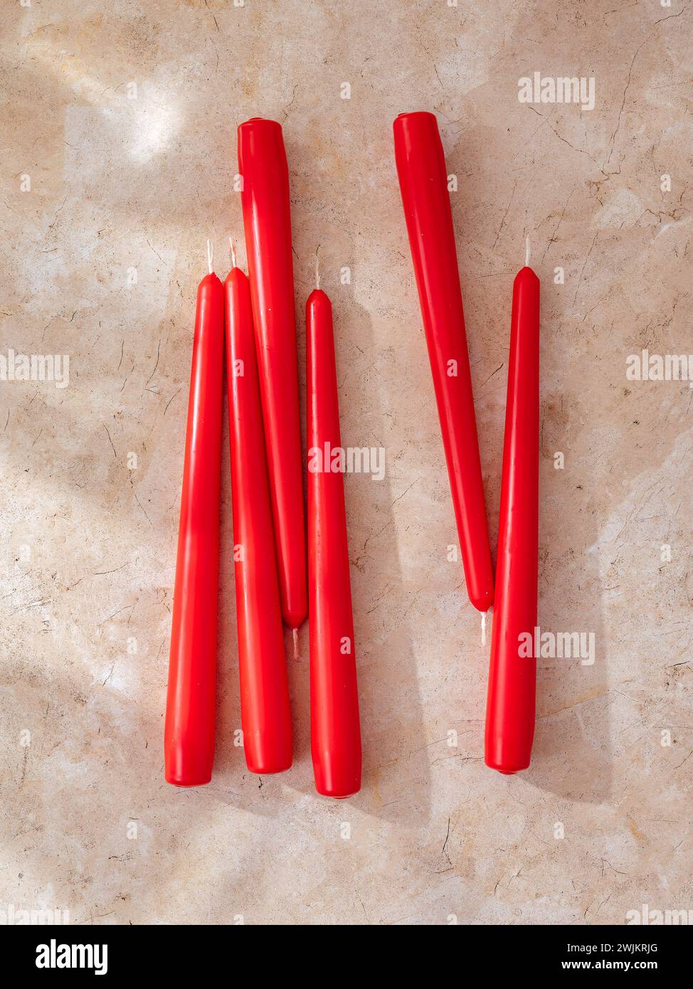 whole candles are lying on the table Stock Photo - Alamy
