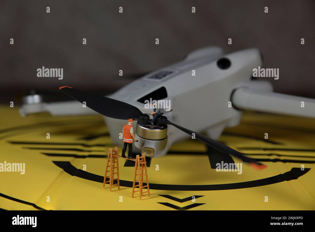 miniature figures checking the working of the drone propeller Stock ...
