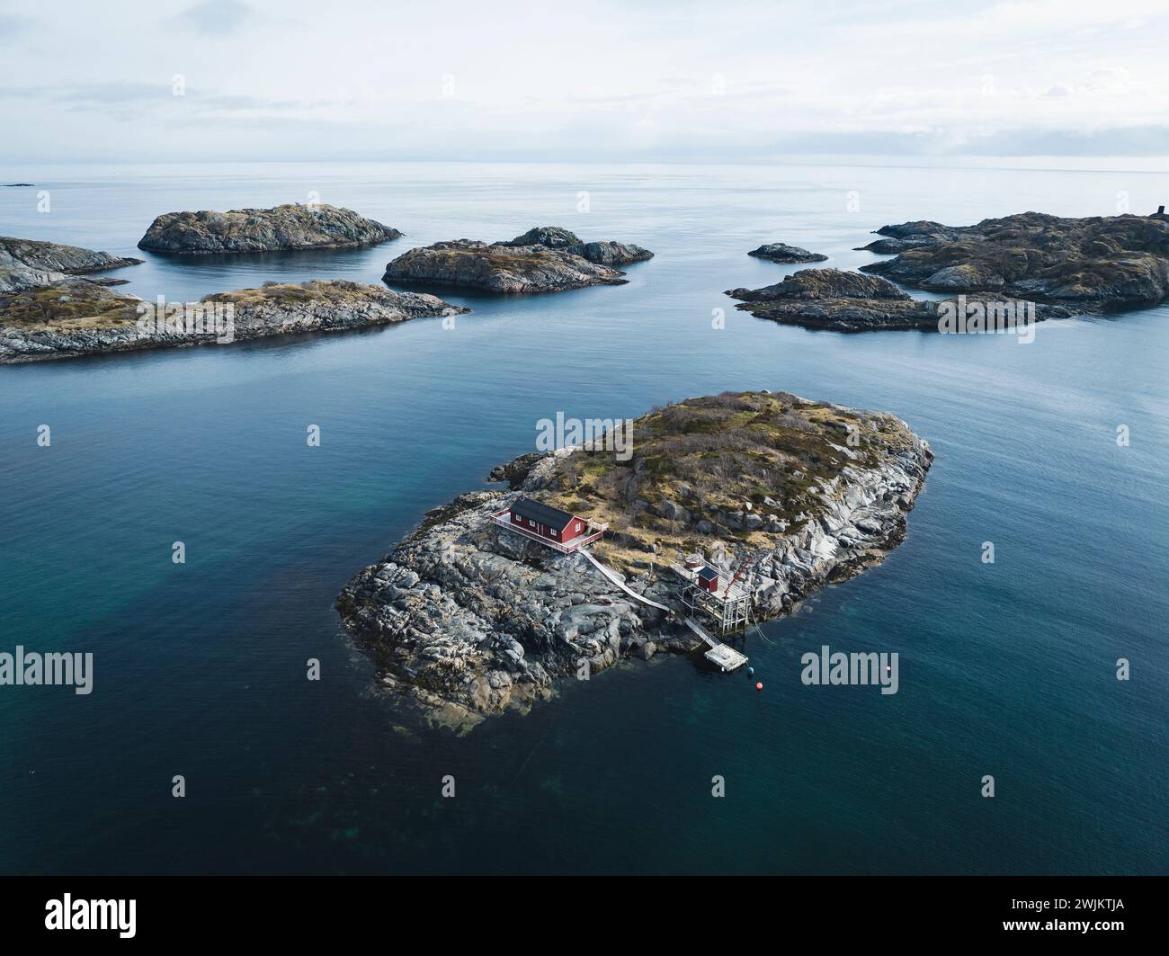 Drone shot of houses and rocks on island amidst sea Stock Photo - Alamy
