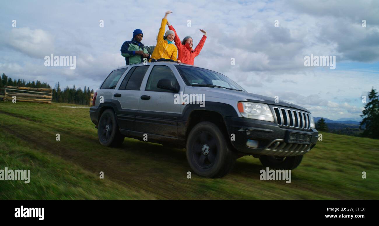 Group of multiethnic tourists together ride on vacation in mountains ...