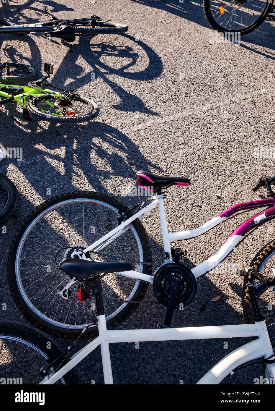 Bicycles on the ground at bike day in Villajoyosa Stock Photo - Alamy