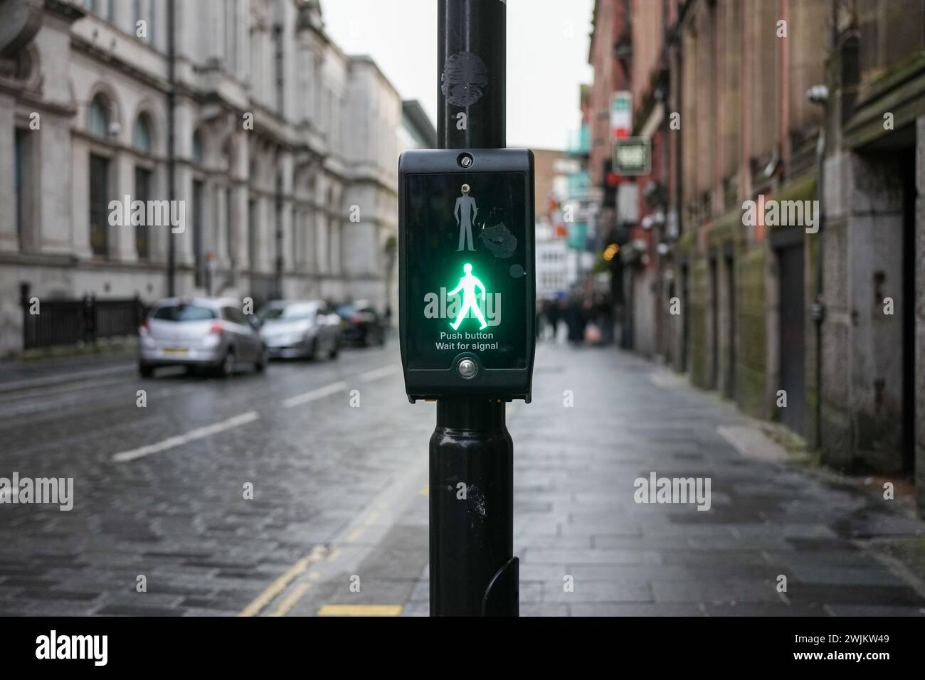 Green man pedestrian traffic signal for crossing the road in the UK ...