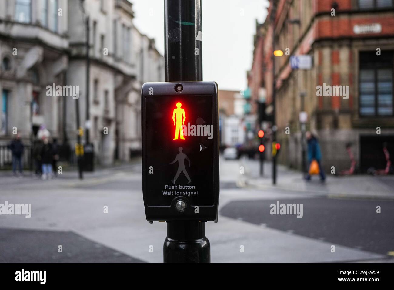 Red man stop sign illuminated at night on traffic light zebra crossing ...