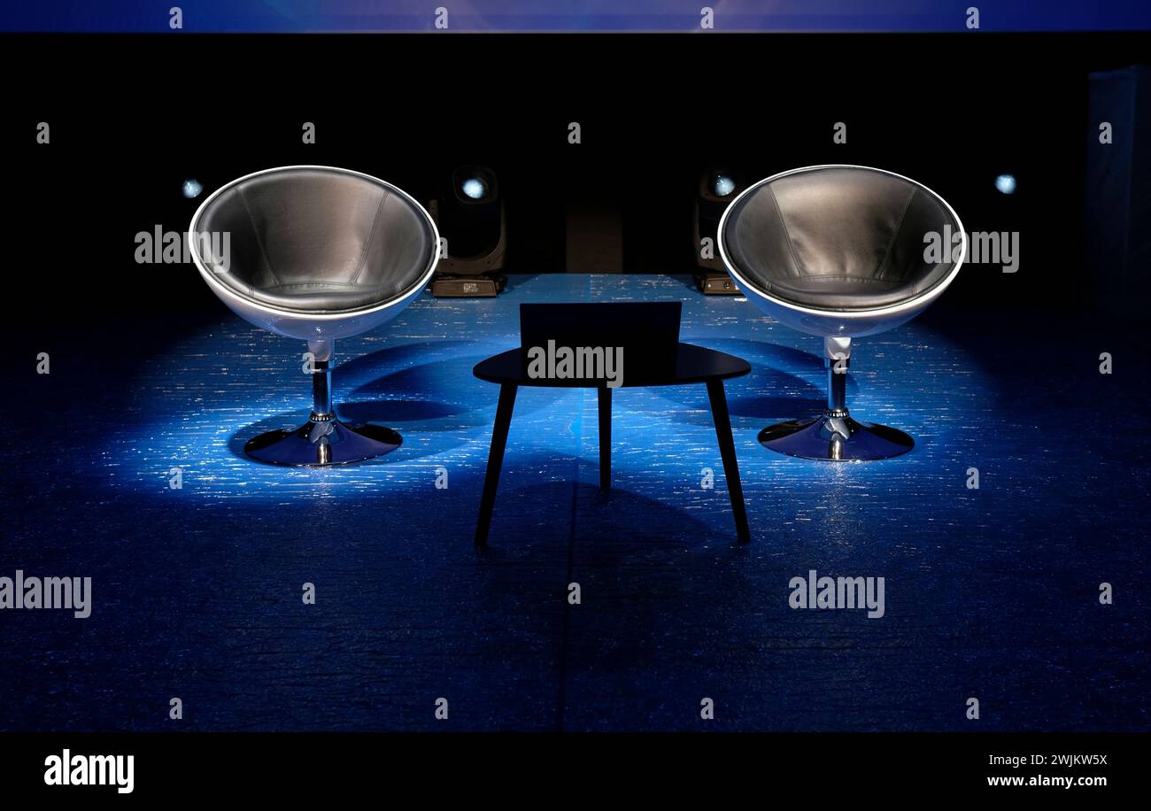 Debate or discussion - two empty chairs on stage with spotlights Stock ...