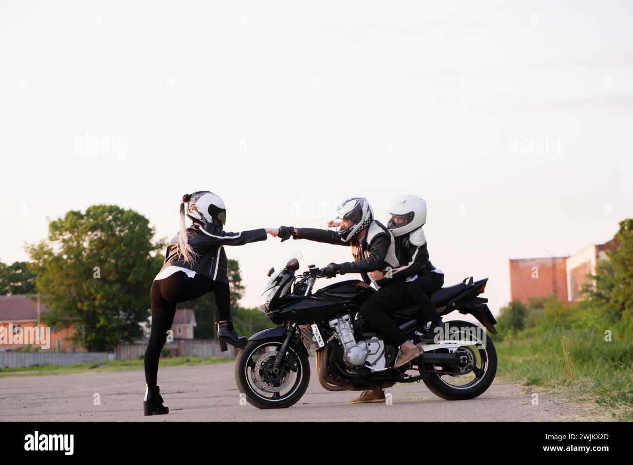 Portrait of a group of bikers on a motorcycle Stock Photo - Alamy