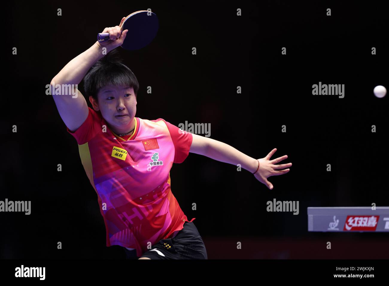 Busan, South Korea. 16th Feb, 2024. Sun Yingsha of China hits a return against Ayhika Mukherjee ...