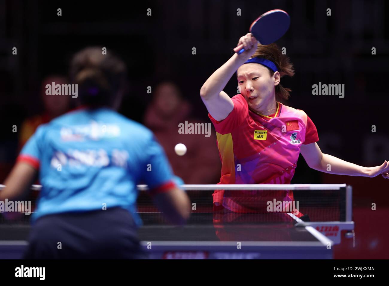 Busan, South Korea. 16th Feb, 2024. Wang Manyu of China hits a return against Ayhika Mukherjee ...