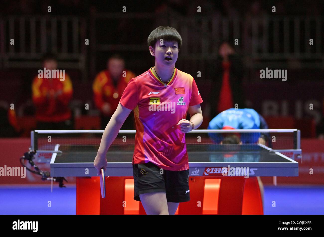 Busan, South Korea. 16th Feb, 2024. Sun Yingsha of China reacts while competing against Manika ...