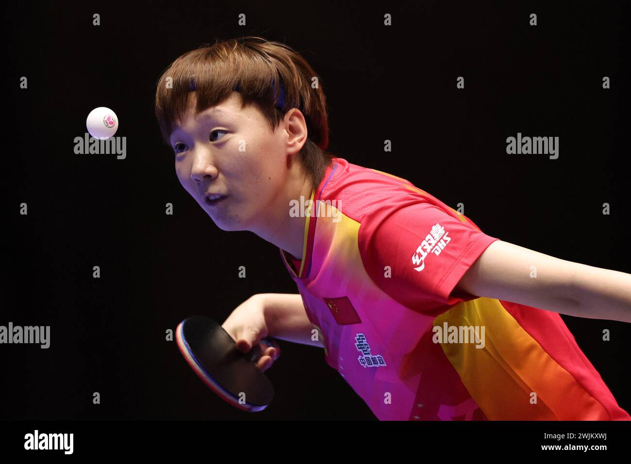 Busan, South Korea. 16th Feb, 2024. Wang Manyu of China serves against Ayhika Mukherjee of India ...
