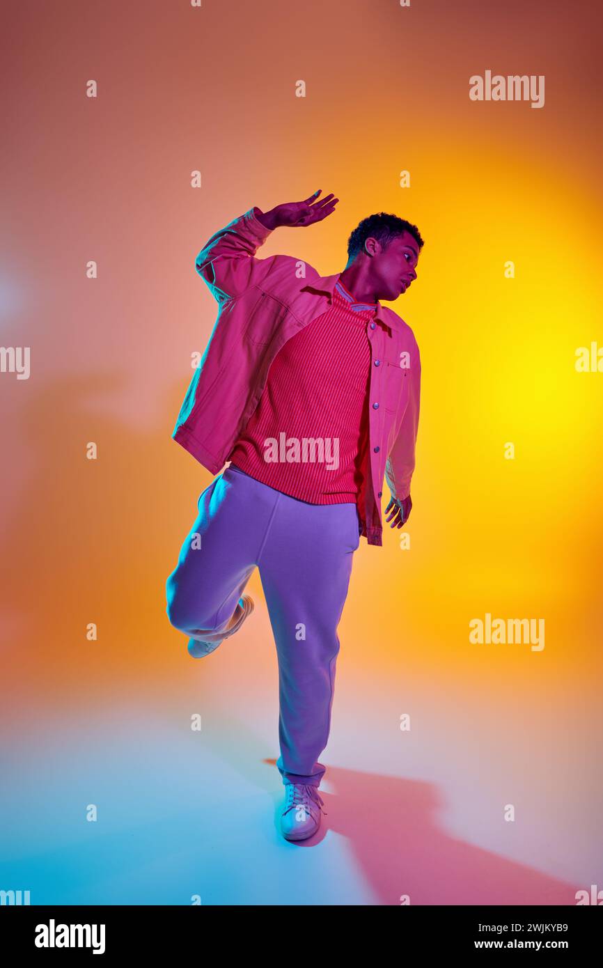 Stylish african american man in trendy clothing with vibrant gradient ...