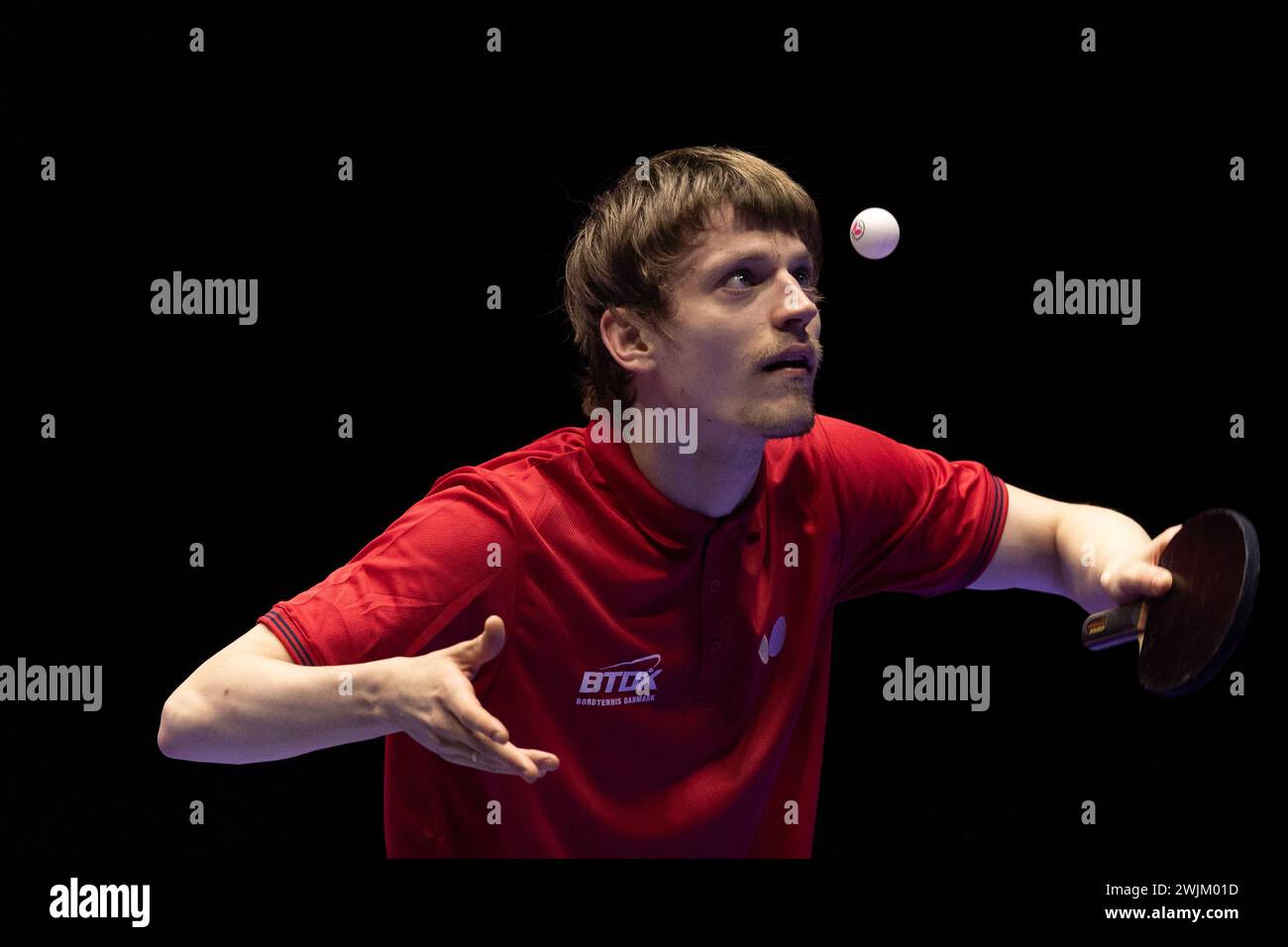 Busan, South Korea. 16th Feb, 2024. Denmark's Anders Lind serves ...