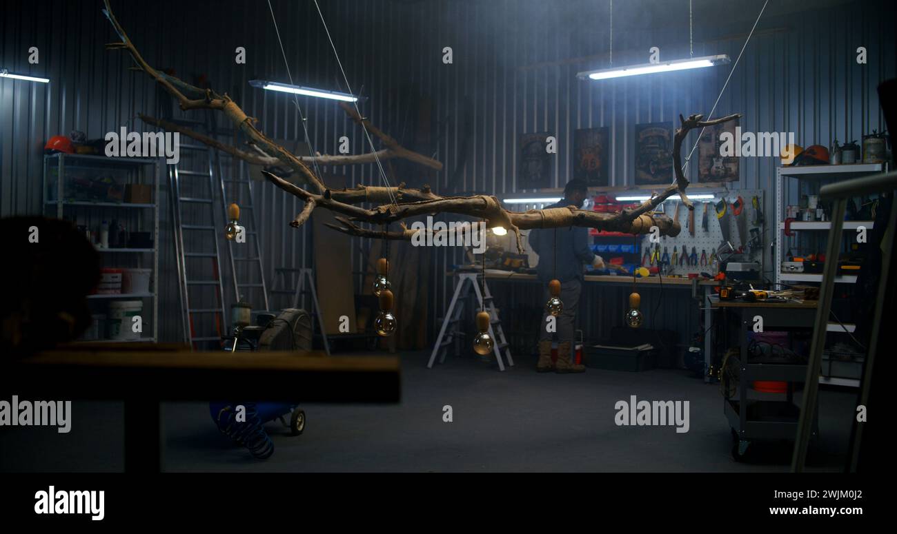 African American carpenter ties with rope design wood product from tree ...