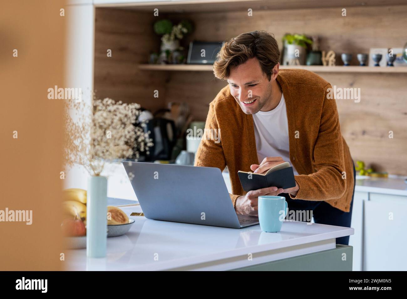 Adult man uploading passport details while buying tickets online Stock ...