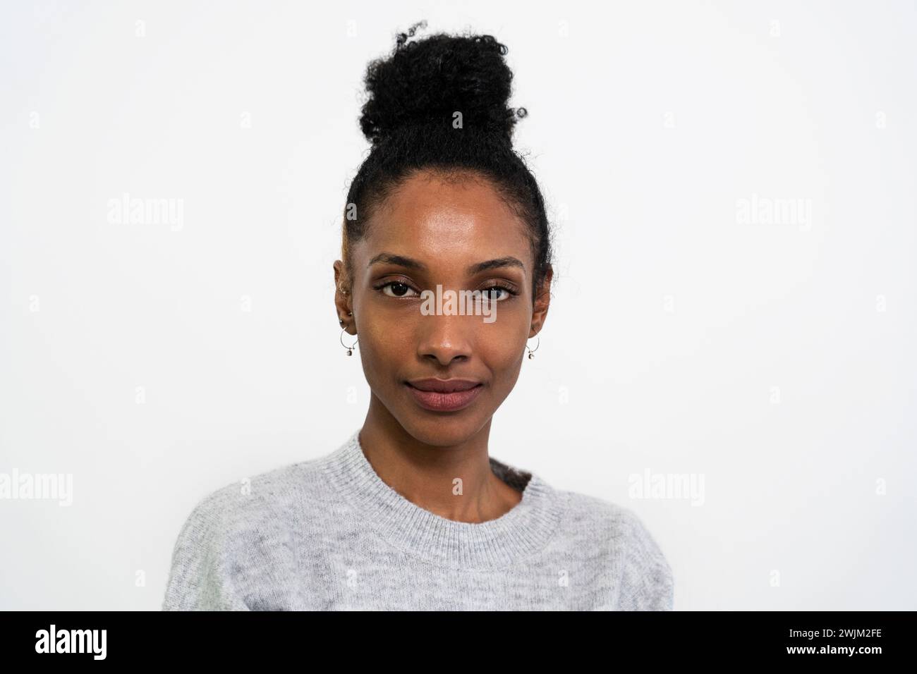 Front view portrait with white background of woman looking at the ...