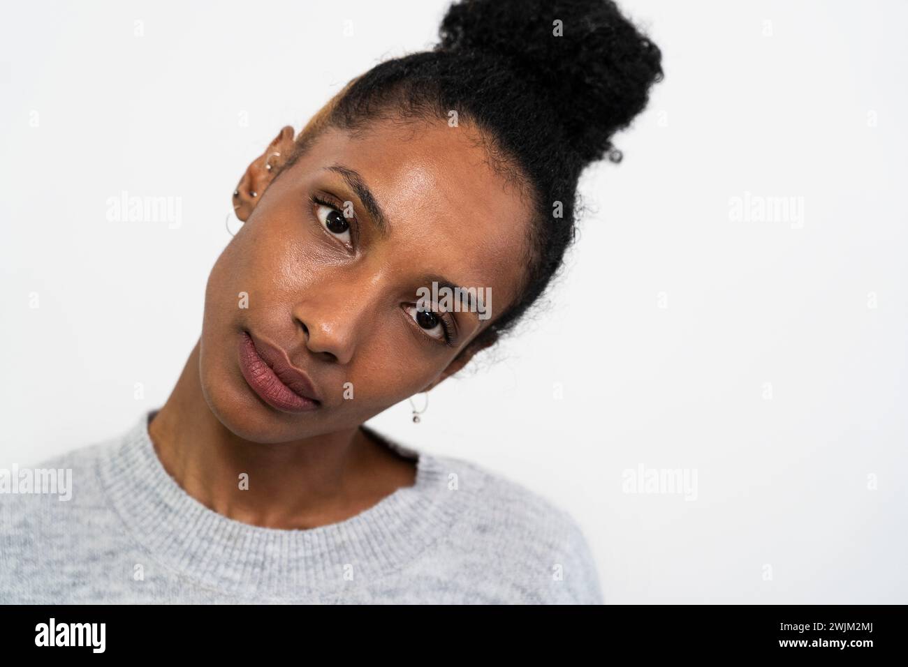 Front view portrait with white background of woman looking at the ...