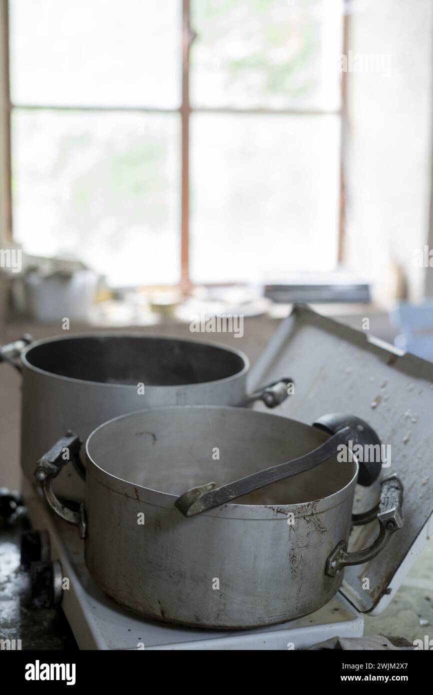 Two cooking pots inside kitchen Stock Photo - Alamy