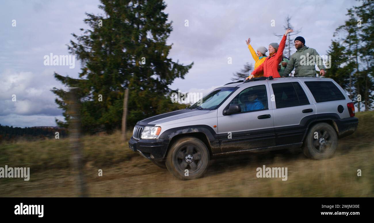 Group of diverse tourists together ride on vacation in mountains ...