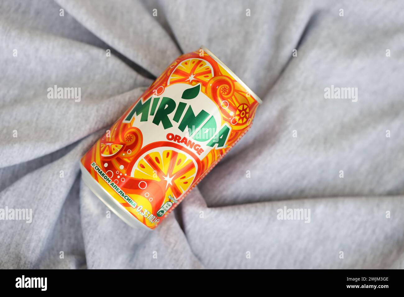 KYIV, UKRAINE - 4 MAY, 2023: Mirinda orange drink in orange citrus tin ...