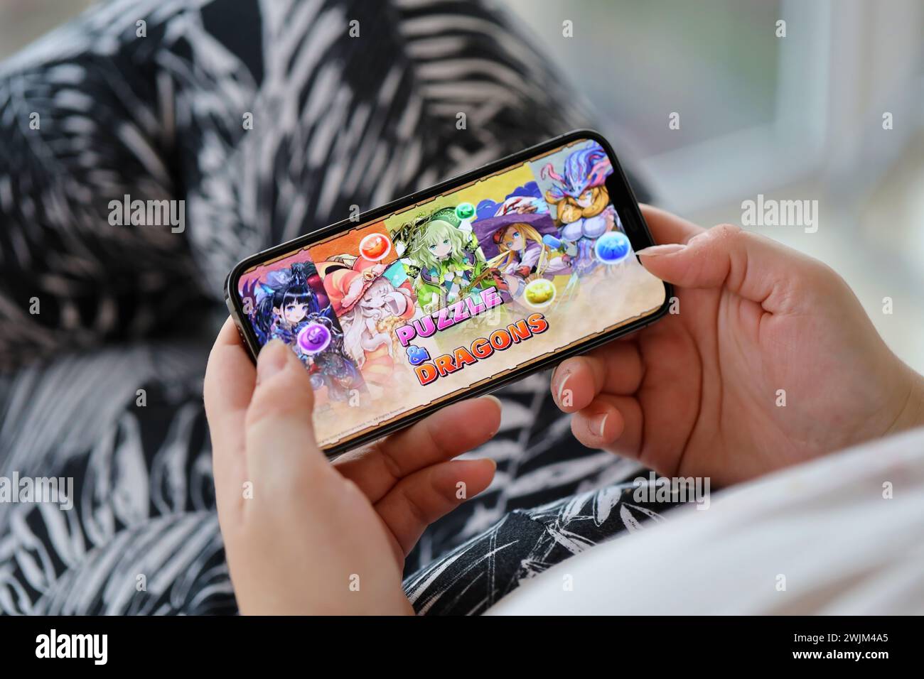 Puzzle and dragons mobile iOS game on iPhone 15 smartphone screen in ...