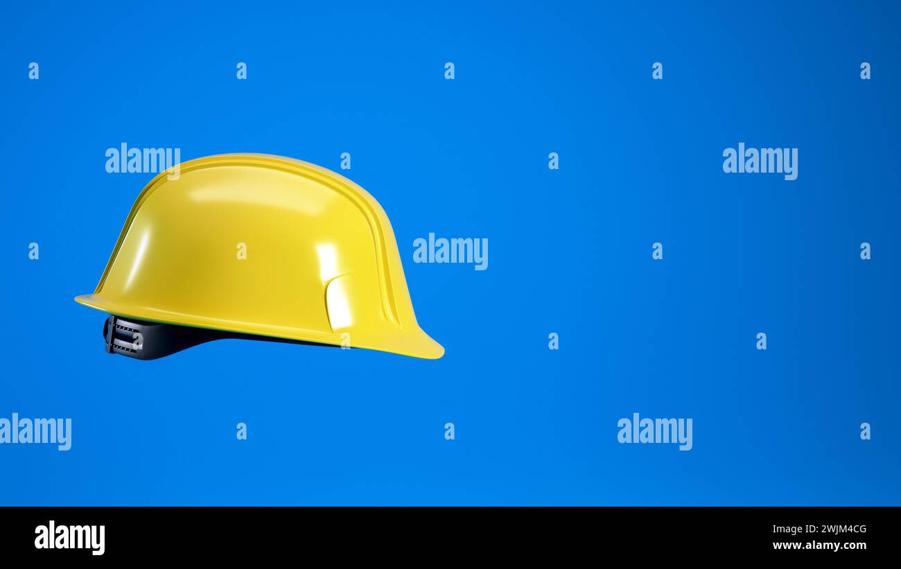 Yellow hard hat isolated on blue background with copy space. Safety ...
