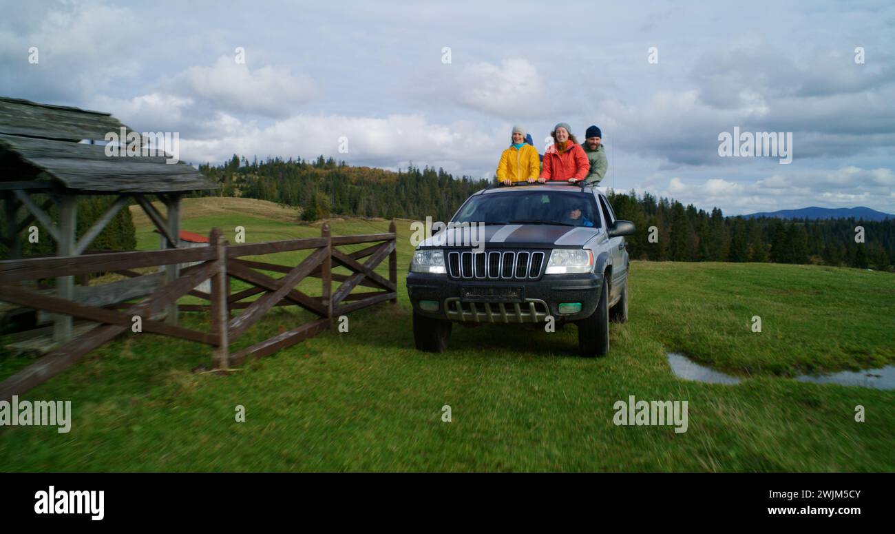 Group of multiethnic tourists together ride on vacation in mountains ...