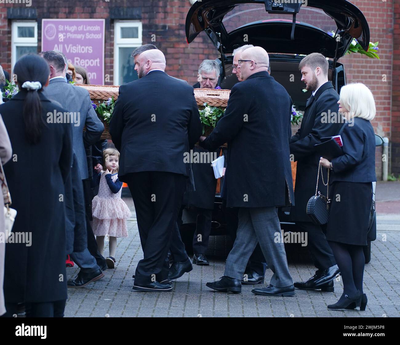 Pall bearers carry the casket into the Requiem Mass for former Rochdale ...