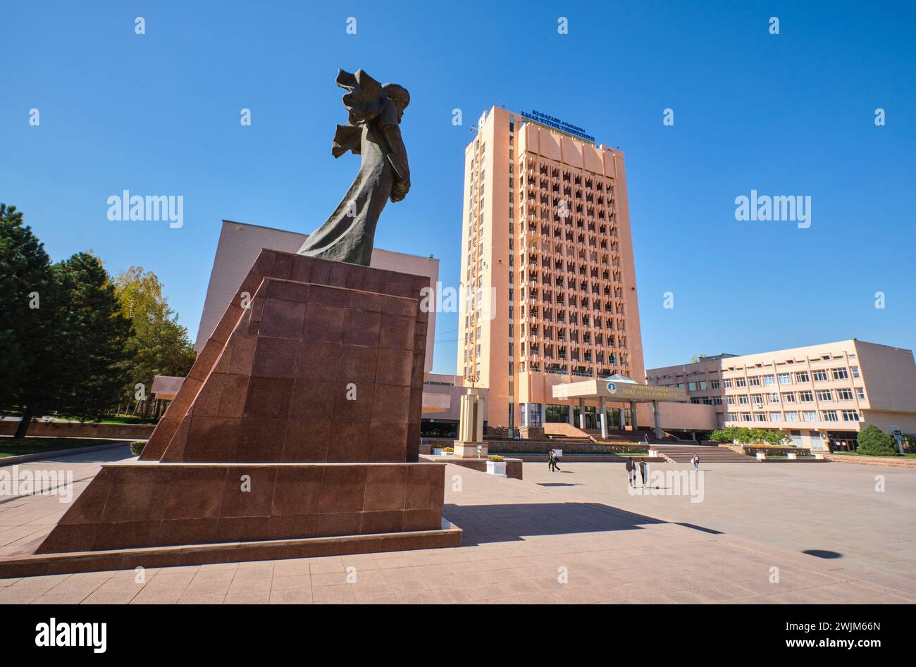 A large statue of the great philosopher with some of the main buildings ...