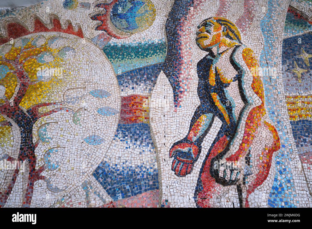 The front entrance to the museum has a large, mosaic, tile mural with ...