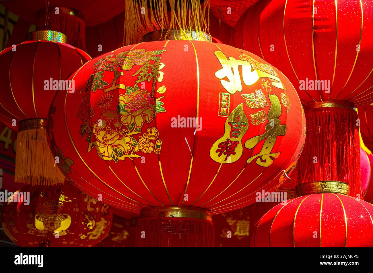 The traditional Chinese red lanterns hanging in front of people’s house ...