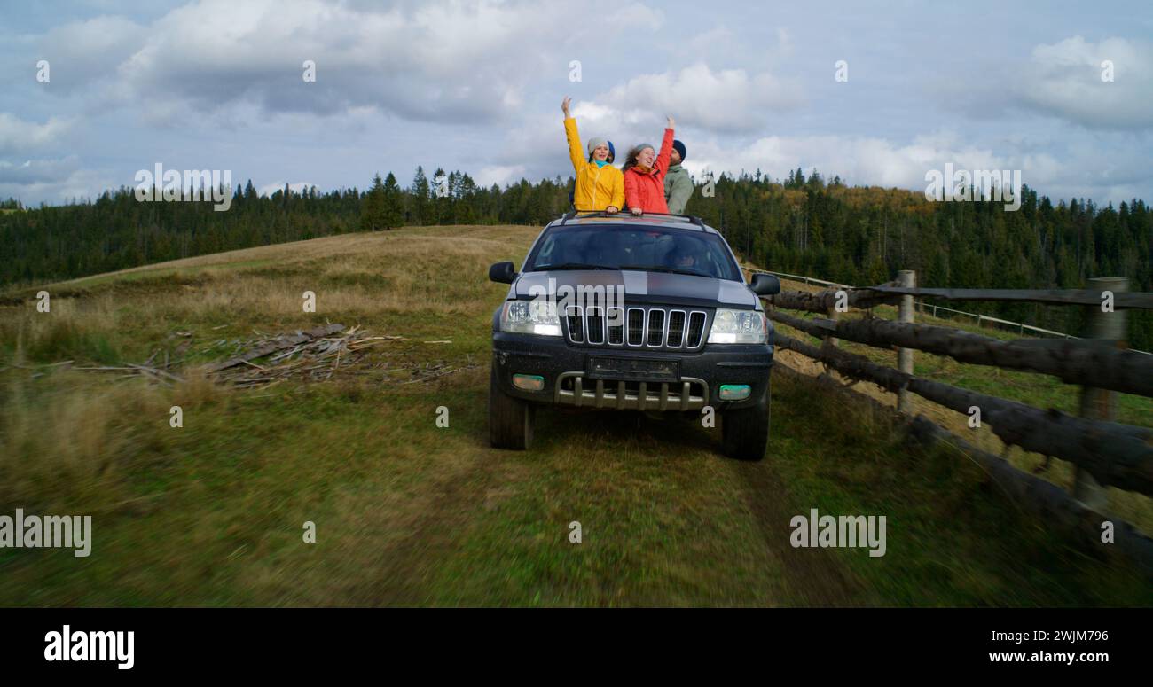 Group of multiethnic tourists together ride on vacation in mountains ...