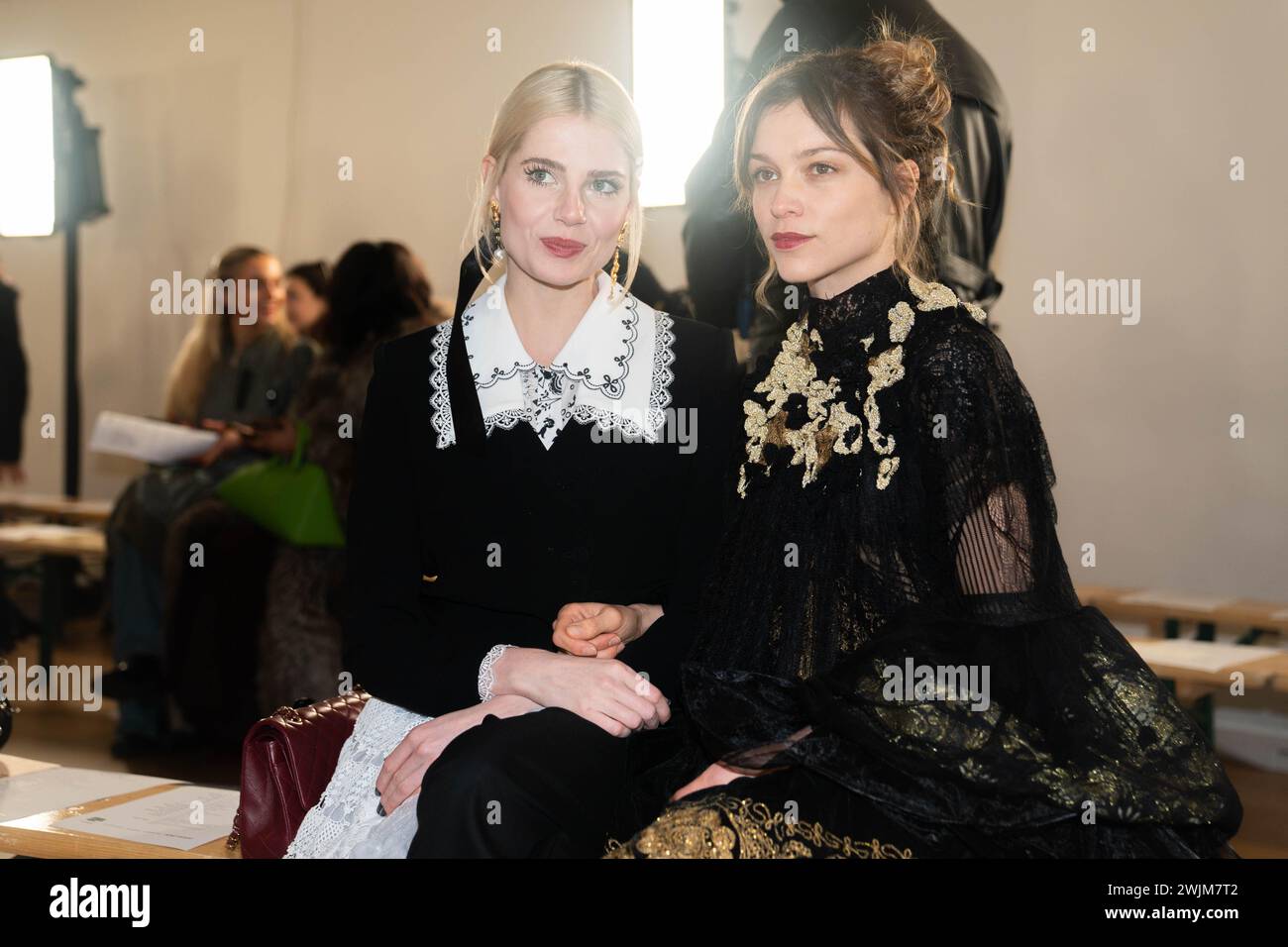 Lucy Boynton and Sophie Cookson pose before the Bora Aksu show at The Hellenic Centre, London ...