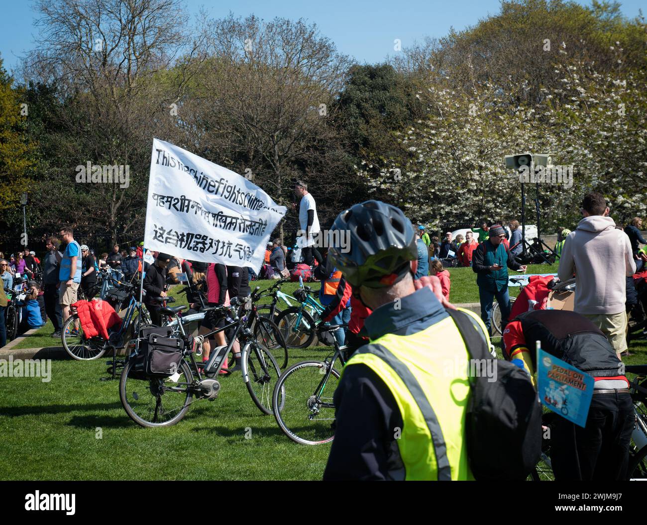 Hundreds of cyclists and people with bikes cycle through the streets of ...