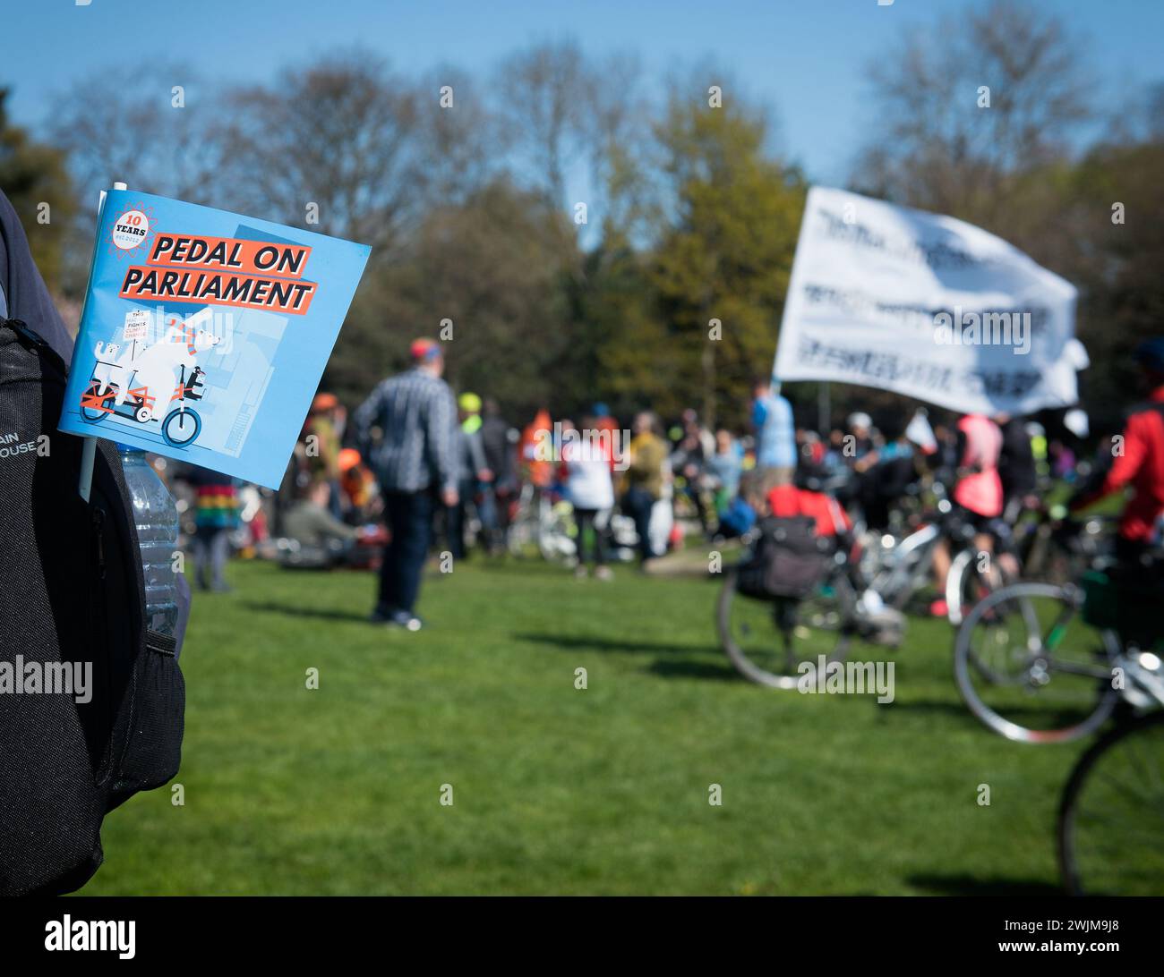 Hundreds of cyclists and people with bikes cycle through the streets of ...