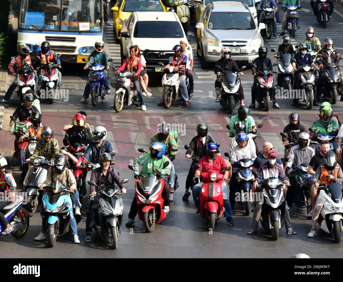 Overhead view of a traffic jam of mainly motorbikes and their drivers ...